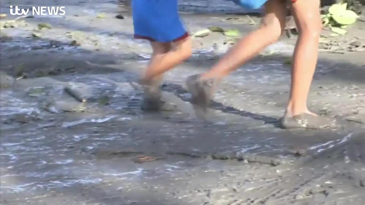 Girl Stuck In Mud After Volcano
